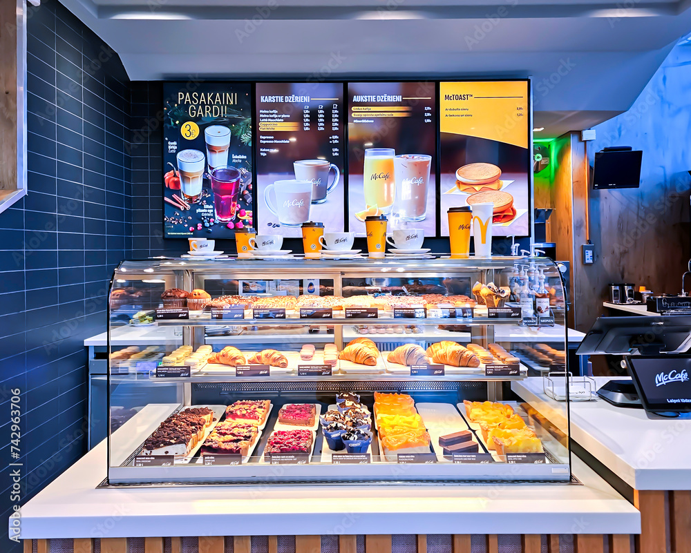 LATVIA, RIGA, FEBRUARY, 20, 2024: McCafe counter with different ...