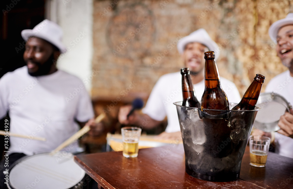 Musician, band and friends with drink, men and happy for drums ...