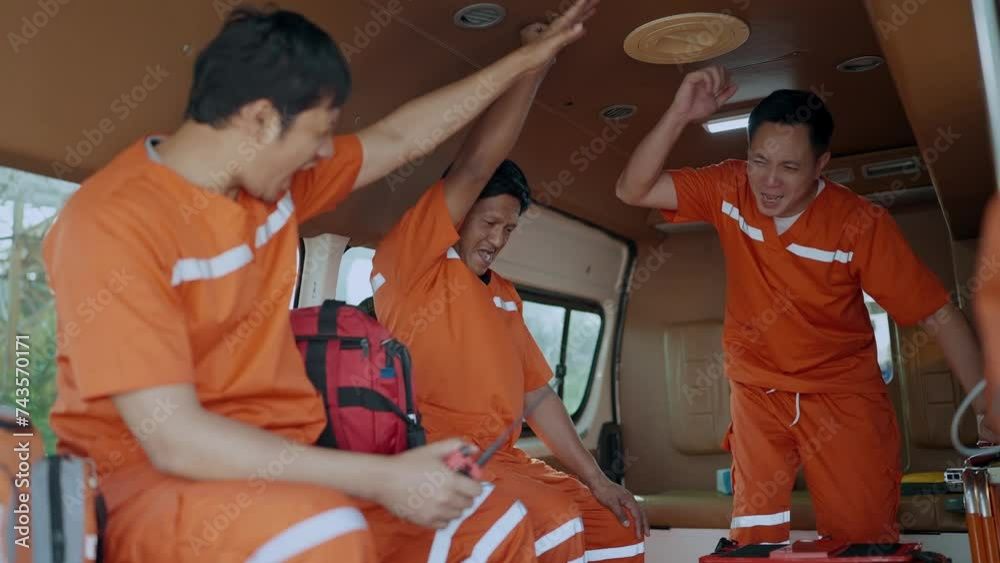 Team asian paramedic in uniform join hands to celebrate success in ...