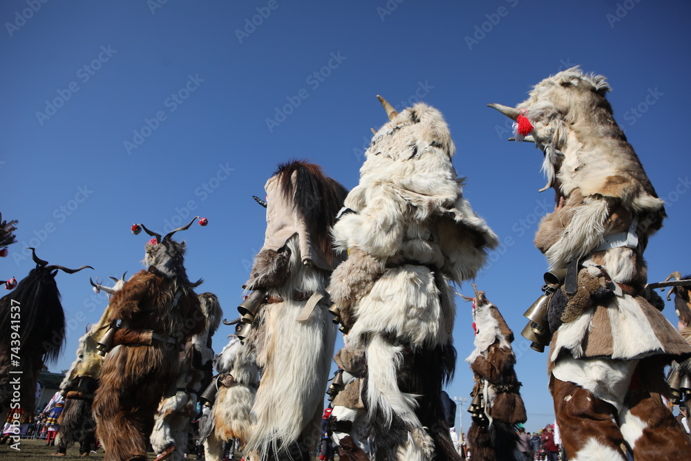 People called Kukeri parade in masks and ritual costumes, perform ...