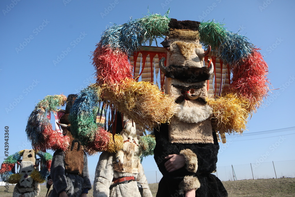 People called Kukeri parade in masks and ritual costumes, perform ...