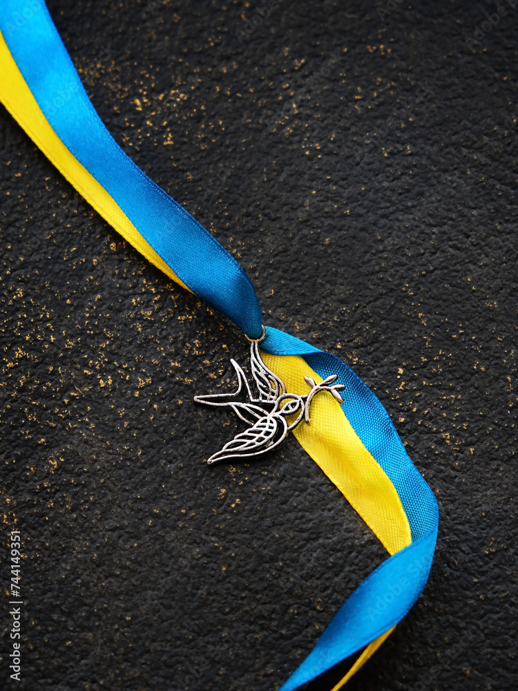 dove pendant and ribbons in the blue and yellow colors of national ...