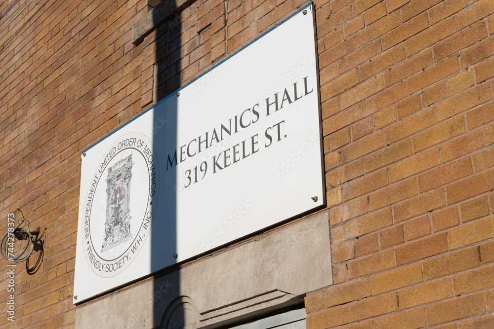 exterior wall and outdoor sign over entrance to Mechanics Hall located ... exterior wall and outdoor sign over entrance to Mechanics Hall located ...