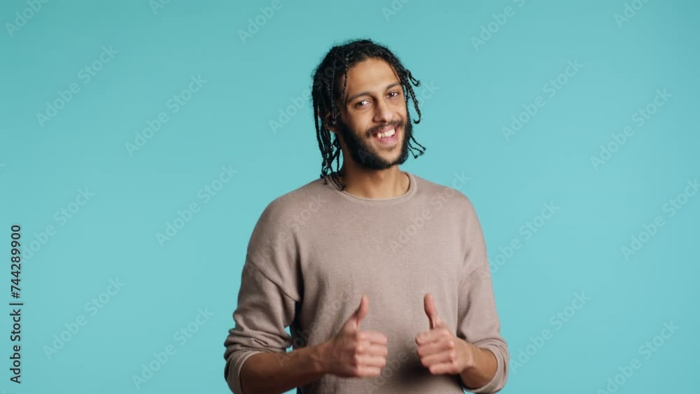 Man doing thumbs up hand gesturing, showing approval, having positive ...