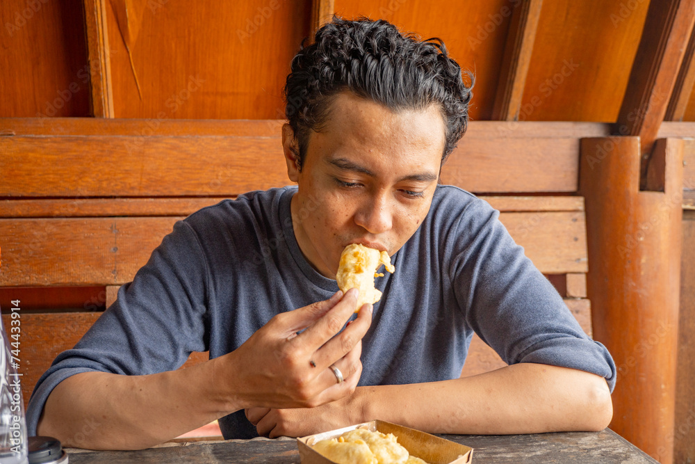 Man expression happy smile surprised when eat the banana fries The ...