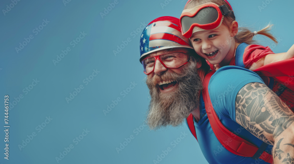 A joyful father wearing a helmet and red goggles gives a piggyback ride ...
