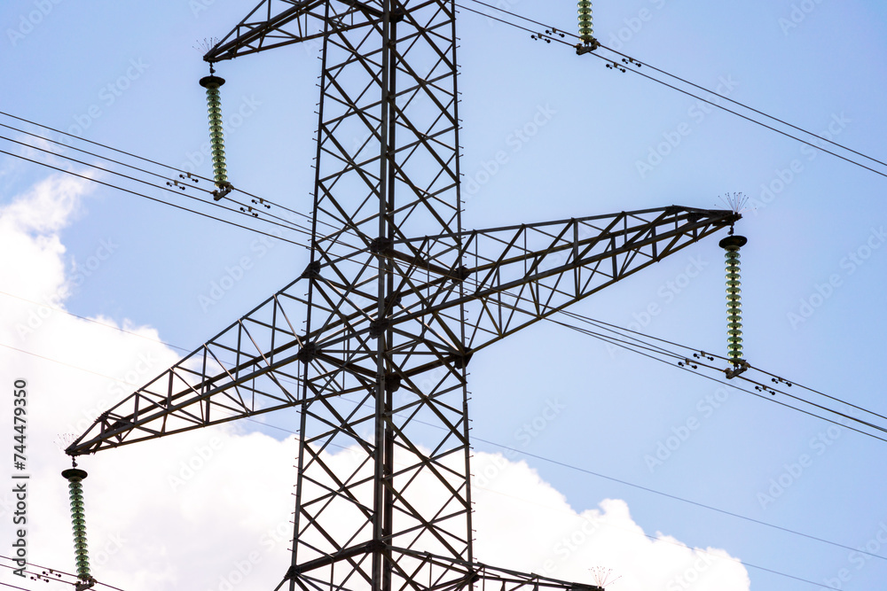 High voltage towers with sky background. Power line support with wires ...