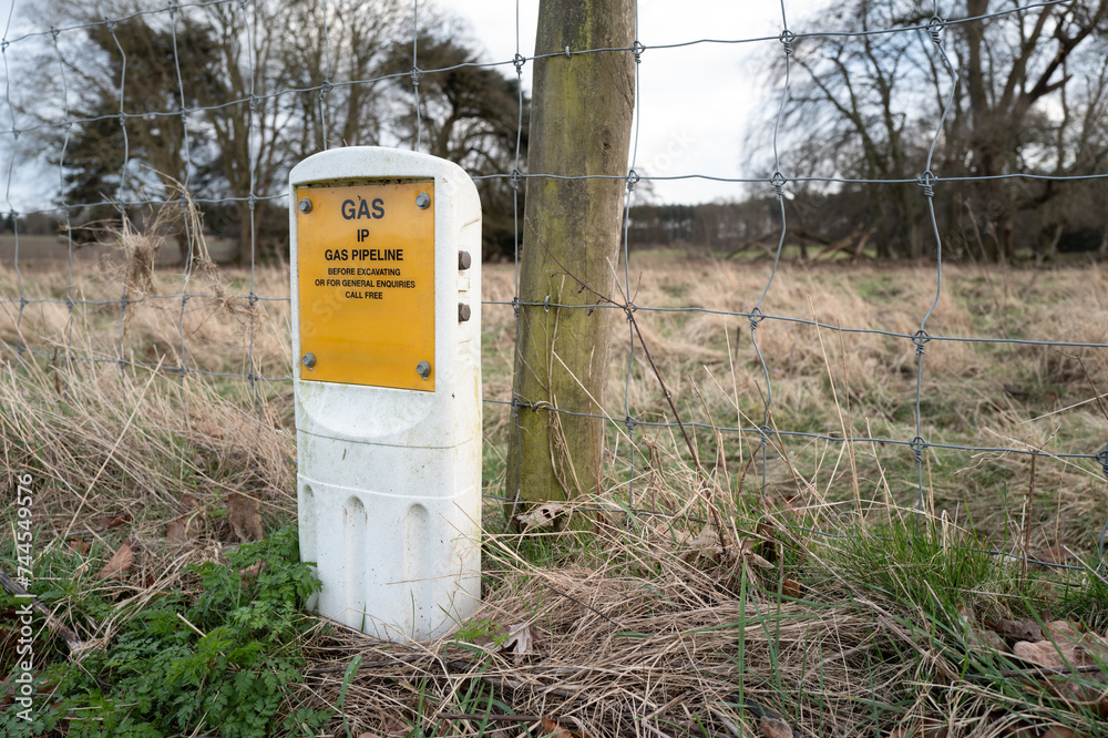 Shallow focus of a mains gas pipeline marker which shows the location ...