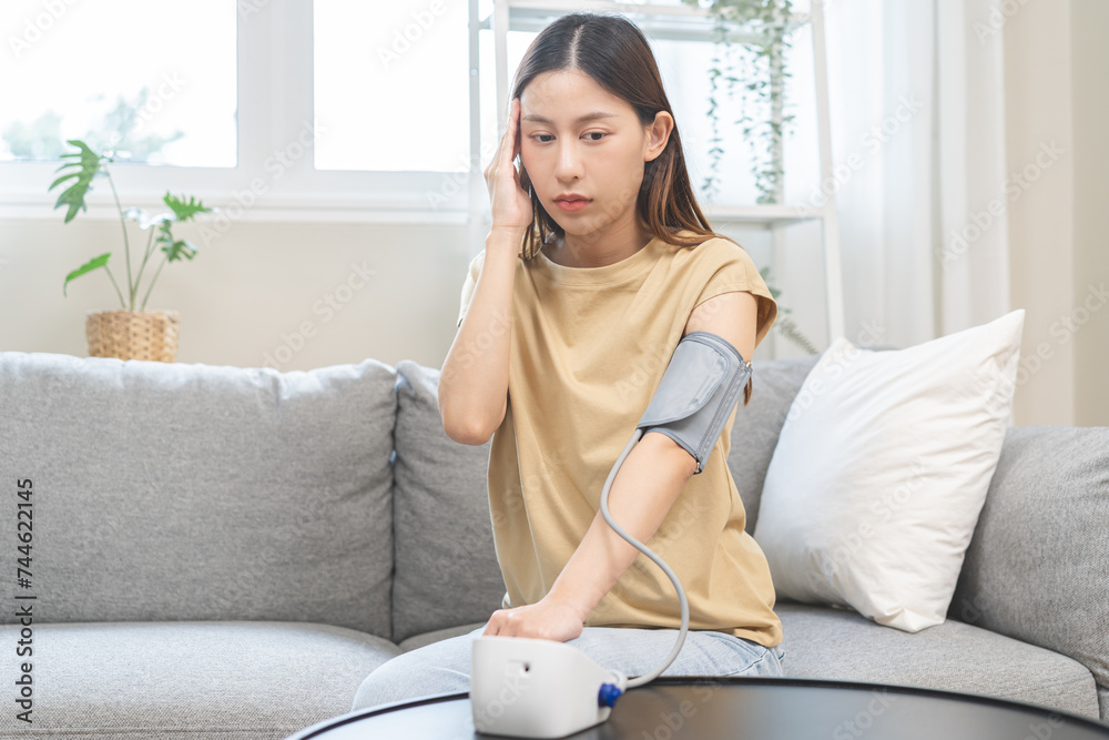 Hypotension problem, sick asian young woman dizzy, faint sitting on ...