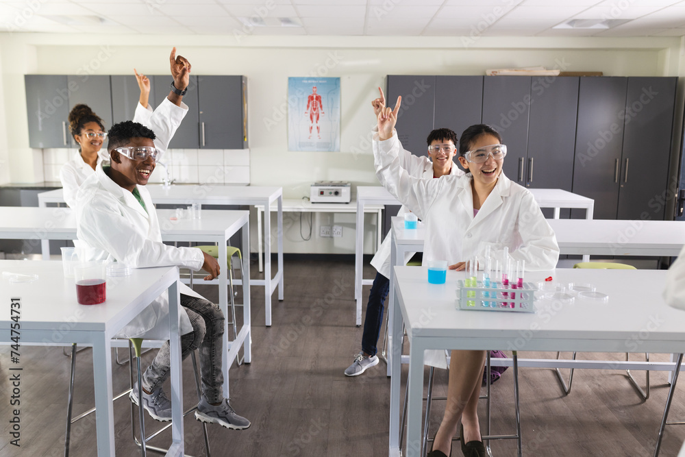 Diverse students celebrate in a science lab, with copy space Stock ...