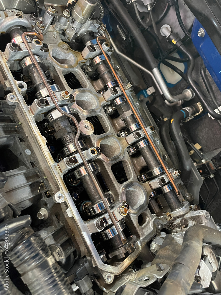 Explore the car engine with the rocker cover removed, revealing ...
