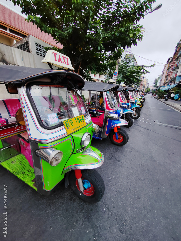 Bangkok , Thailand - February 24,2024 : Multi-colored tuk-tuks lined up in side streets. Stock ...
