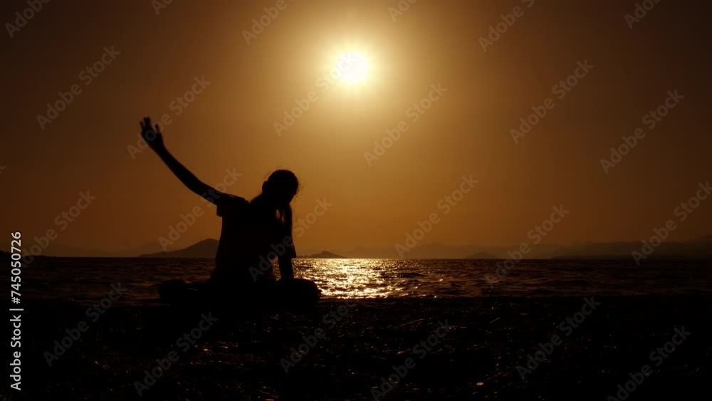 Athletic girl silhouette doing summer zen. An athletic girl silhouette ...