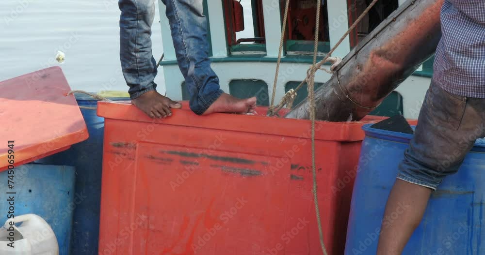 crushed ice being loaded into the ice chest sits in the front of the ...