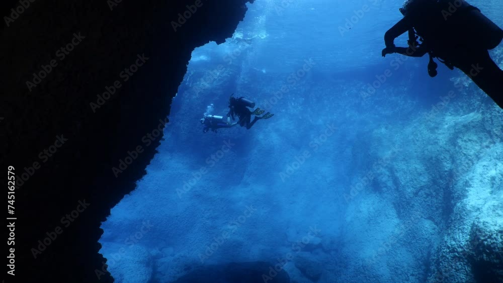 cave diving underwater scuba divers exploring caves and having fun ...