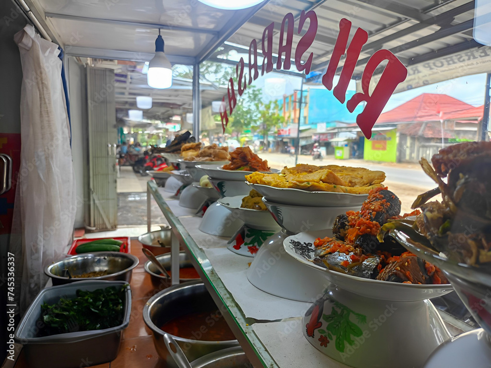 Delicious dishes of typical Padang food with a neat layout and ...
