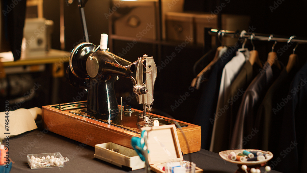 Fashion atelier sewing machine and tools on workshop table, luxury ...