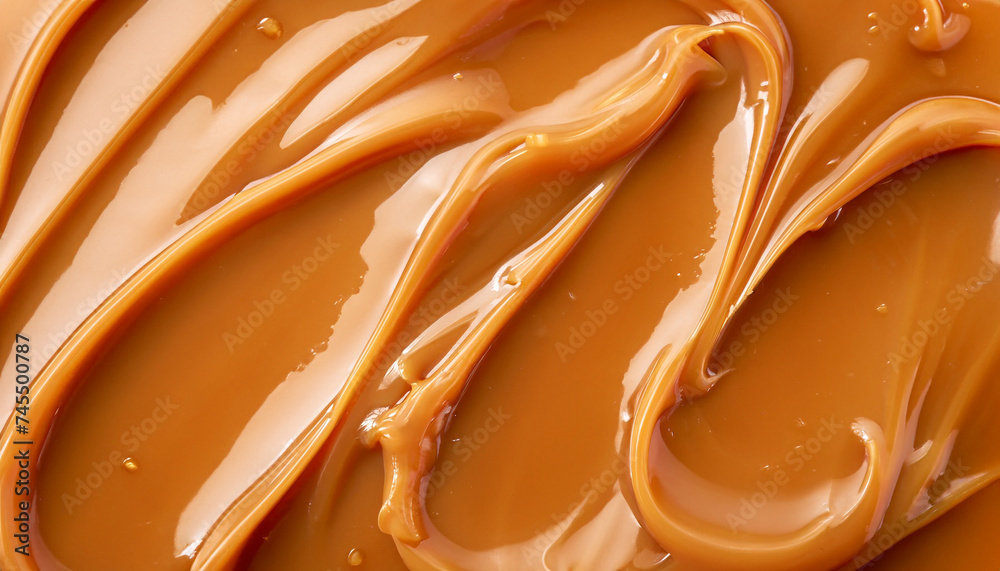 Liquid caramel syrup dulce de leche background. Top view. Stock Photo ...