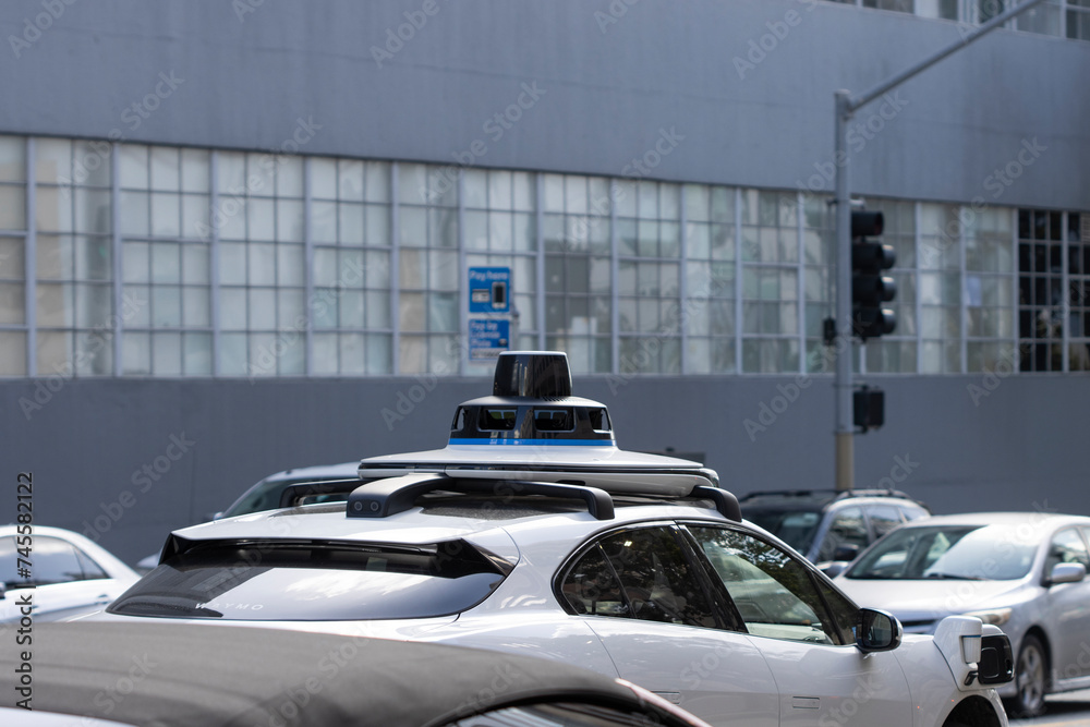 San Francisco, CA, USA - Feb 22, 2024: A Waymo robotaxi navigates the ...