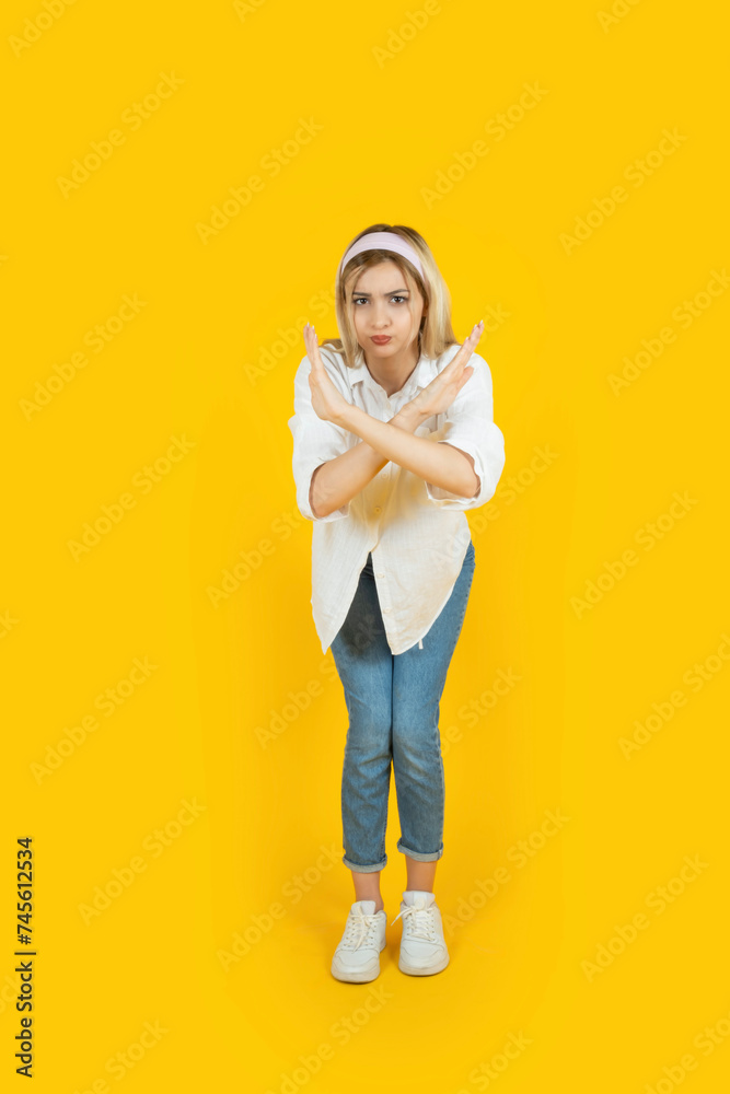 Stop it is enough, full body view young blonde angry woman show cross ...