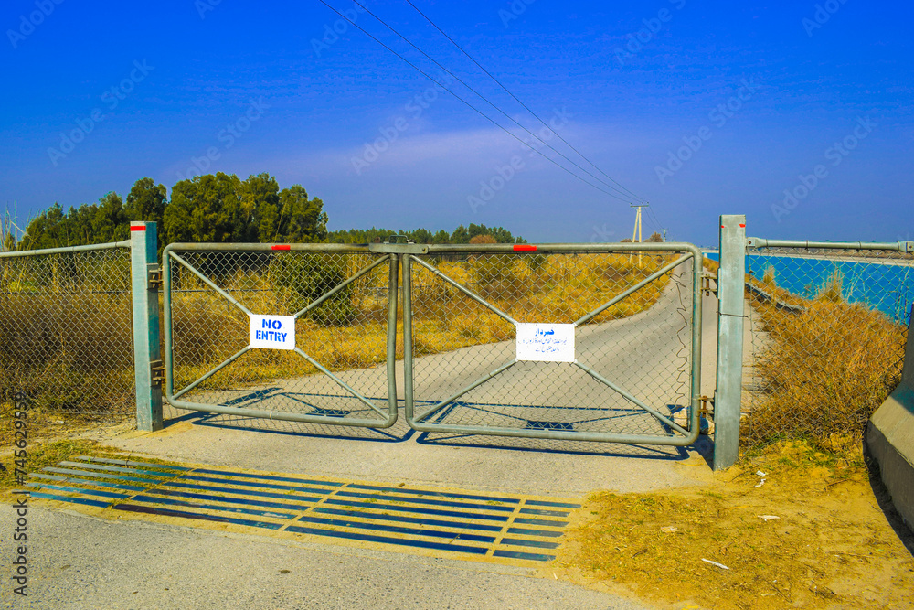 Foto de Сlosed gate with inscription No entry, Do not go inside this ...