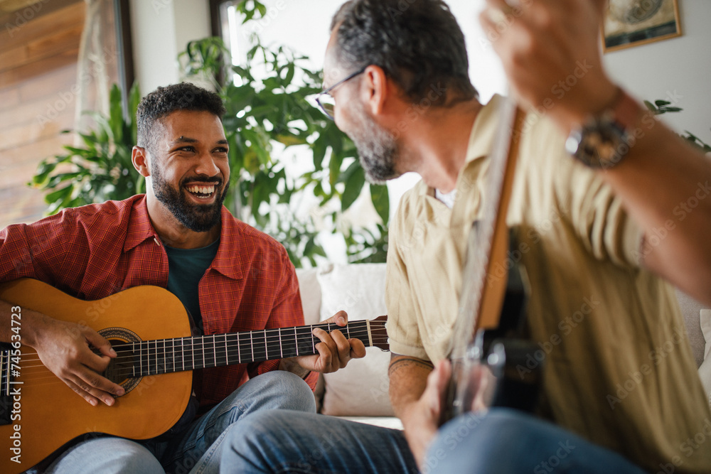 Best friends, musician jamming together. Playing music on guitar ...