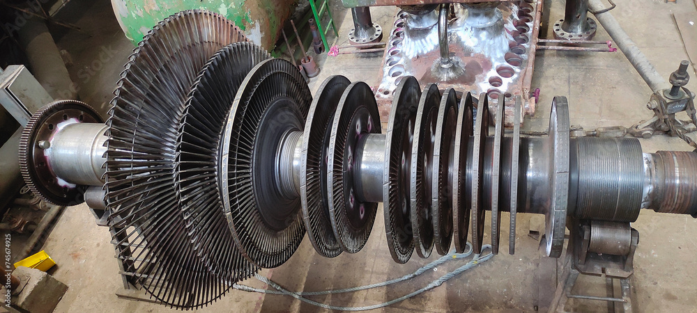 Disassembled steam turbine in the process of repairing and electric ...