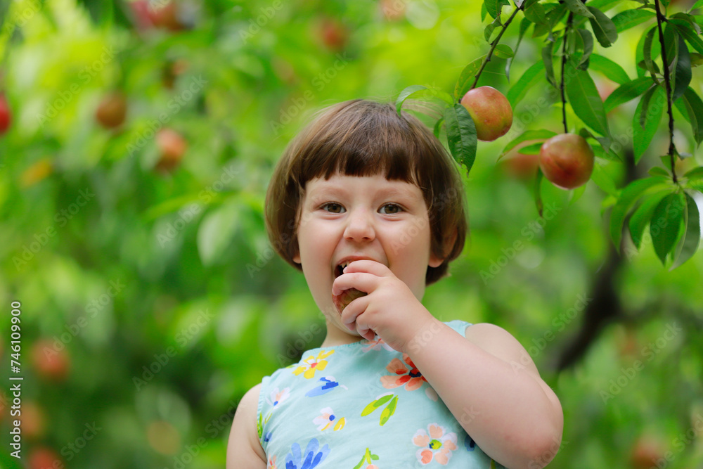 happy little girl eating fruit ,Happy little girl playing under fruit ...