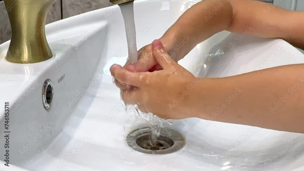Child washing hands and showing soapy palms. Health care and kid ...