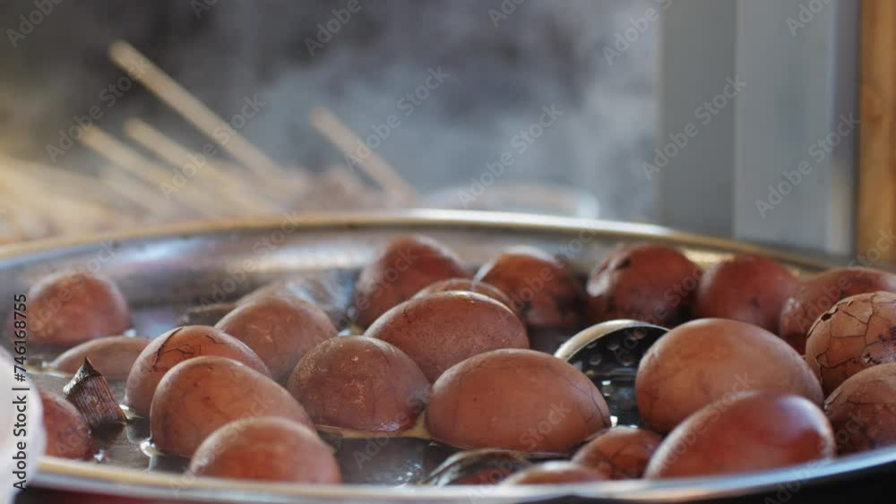 Chinese century eggs or tea egg in boiling water close-up. Chinese egg ...