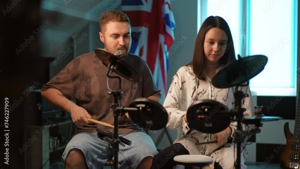 Slow motion. Having played synchronously on an electronic drum set, a ...