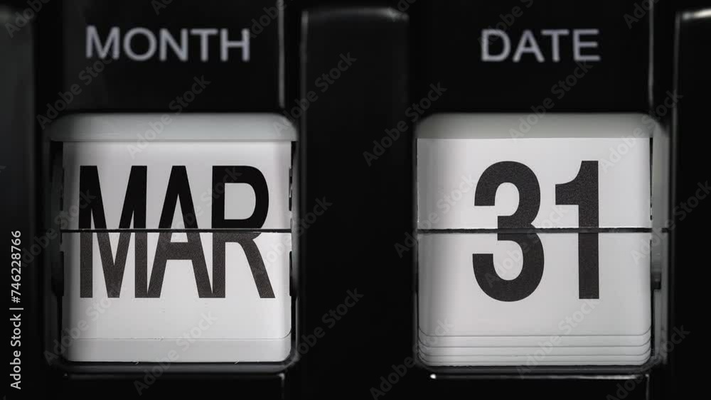 retro flip calendar with a date change from the thirtieth of March to ...