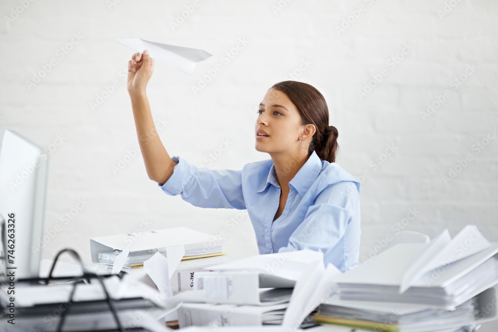 Corporate, businesswoman and paper plane at desk, sitting and thinking ...