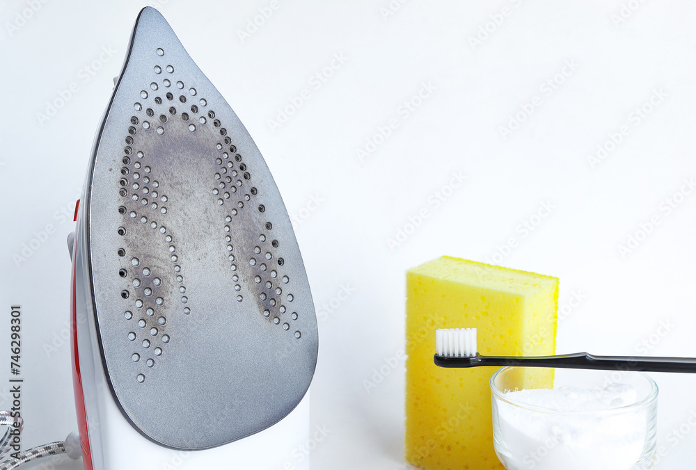 Burnt dirty electric flat iron. Clean an base surface with Baking soda ...