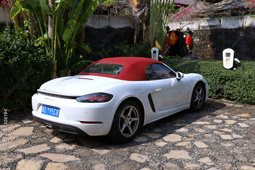 Sanya, China - February 27, 2024: Porsche 718 Boxster near electric car ...