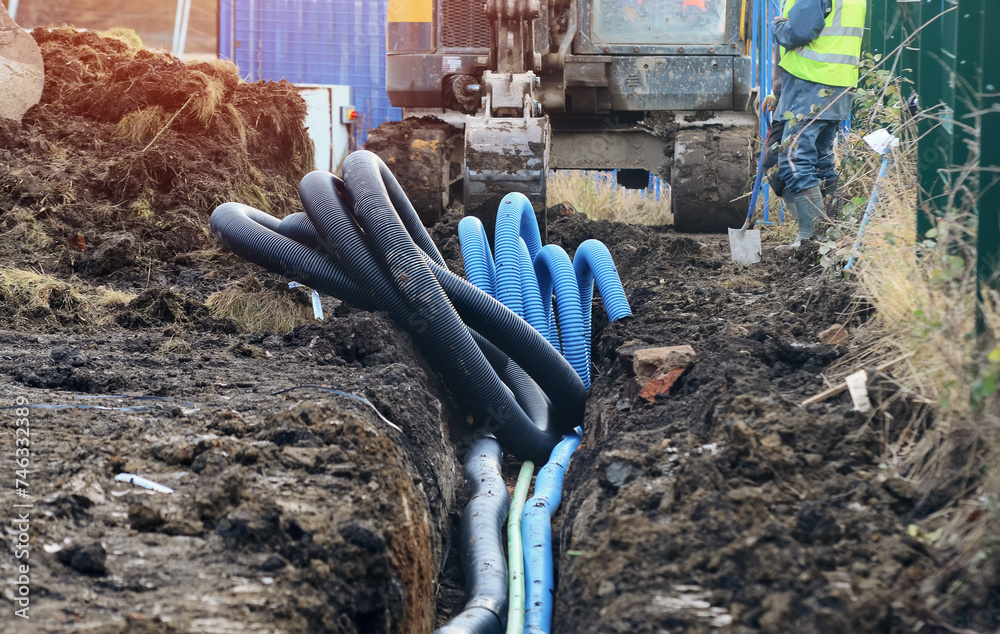 New service duct layid in the open trench to replace new water pipe and ...