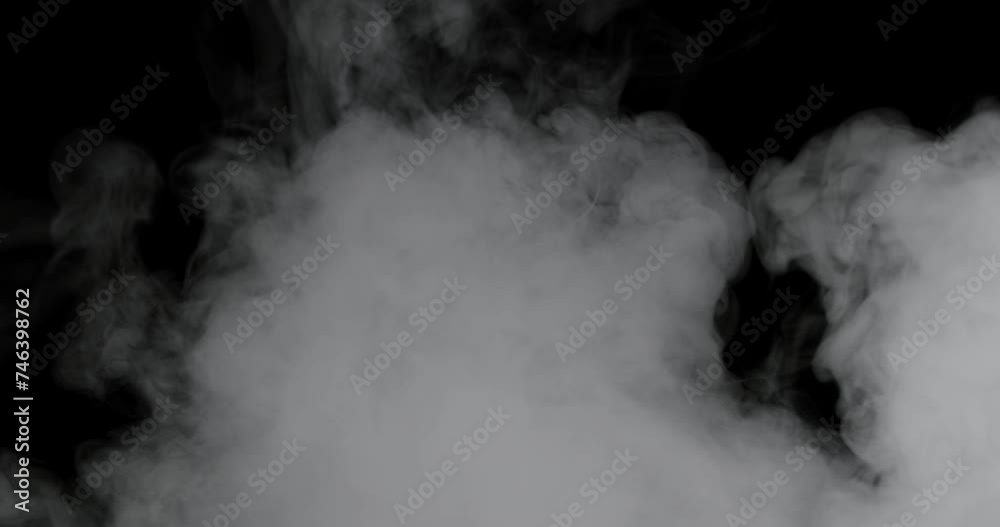 Natural white fog or smoke on dark copy space background in slow motion ...