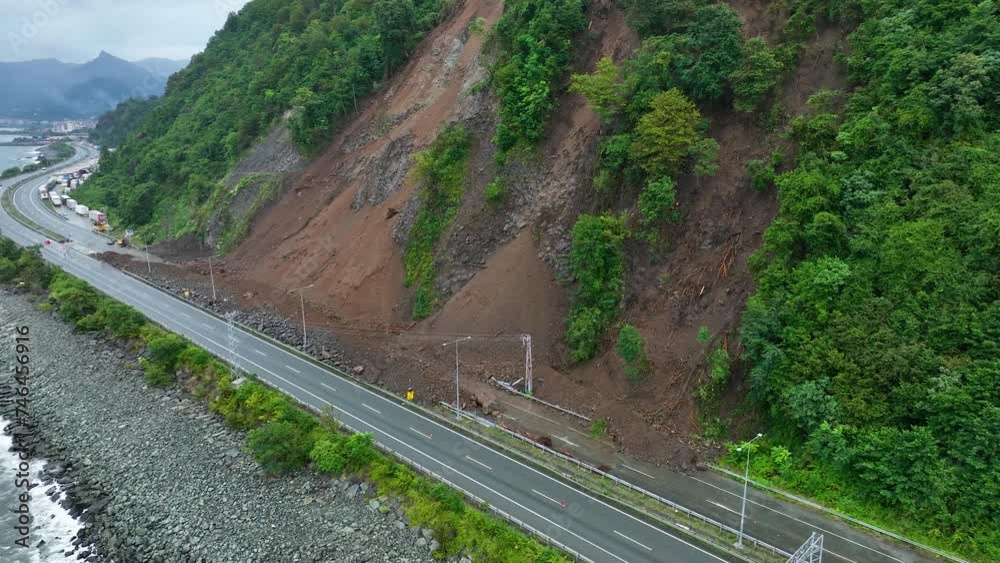 Mountain soil collapse in half of the highway. Landslides due to heavy ...