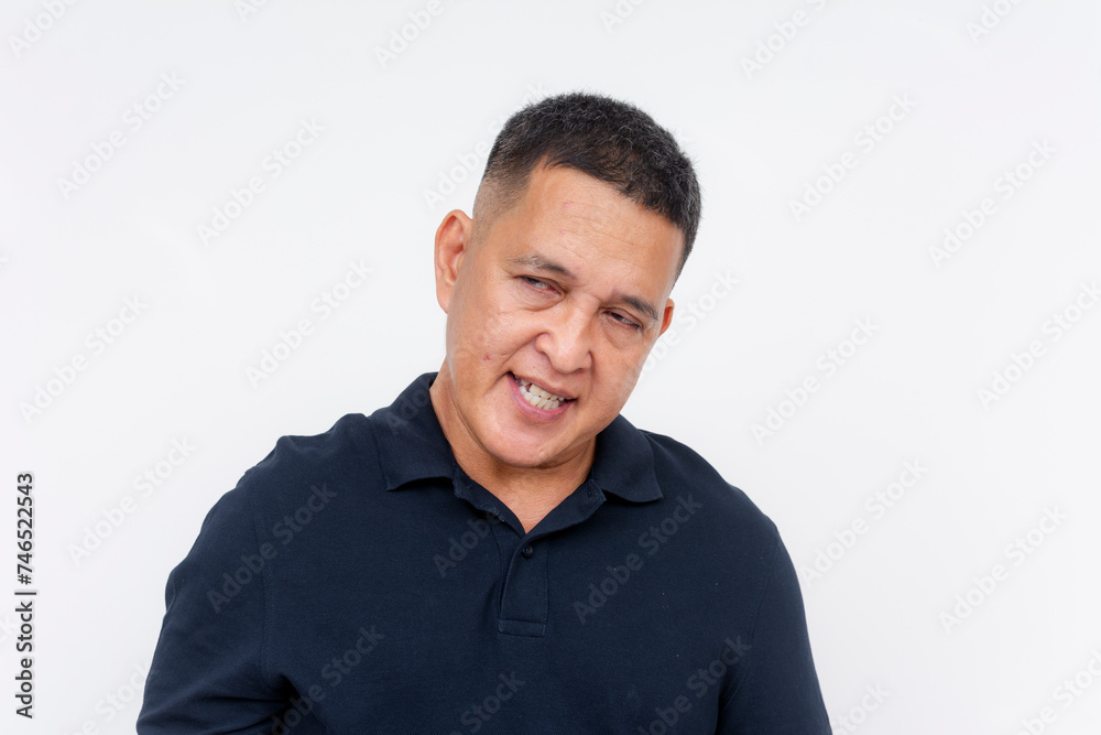 A vengeful and disgruntled middle aged asian man clenching his teeth ...