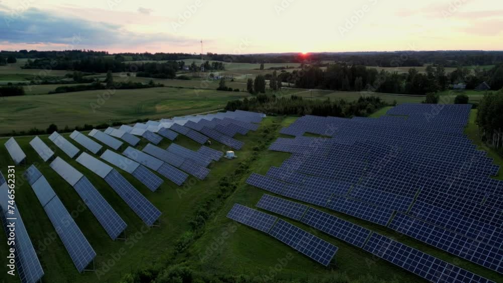 Drone footage of a solar power plant at sunset solar farm with ...