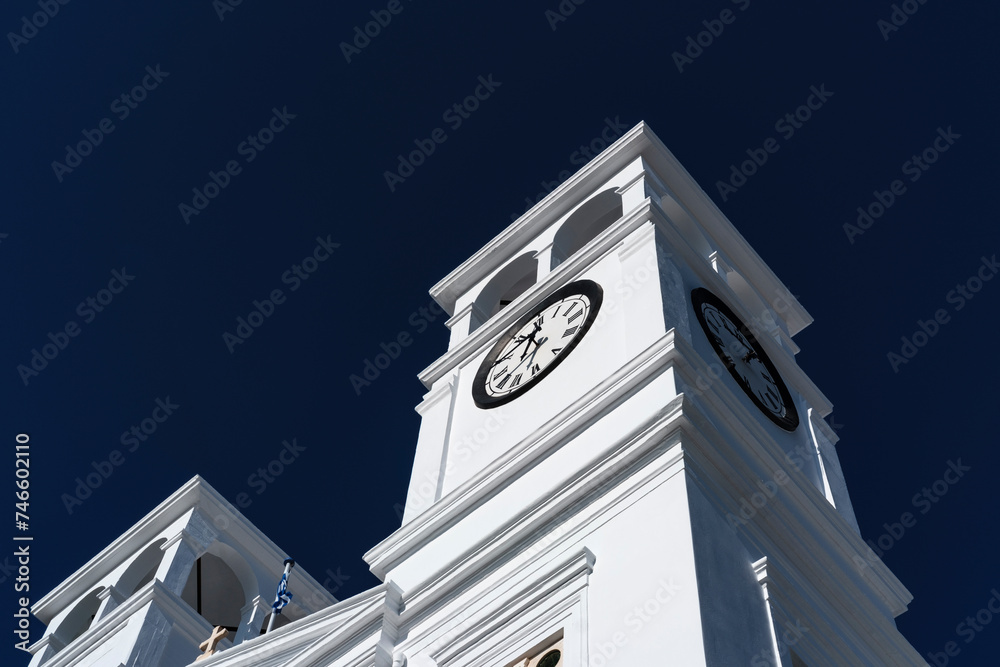 bell and clock tower of typical Greek Orthodox church, whitewashed ...