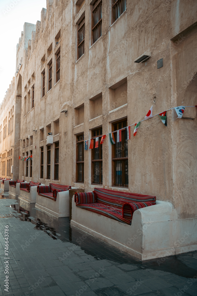 Doha, Qatar - February 8, 2024: White granite benches with red cladding ...