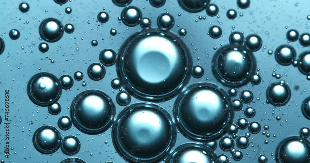 Slow motion macro of floating micro particles molecules in liquid are ...