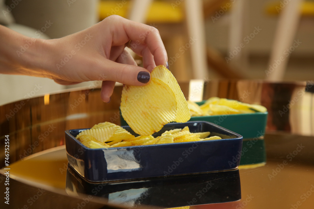 Young Sad Woman Having Unhealthy Snack Eating Potato Chips In The