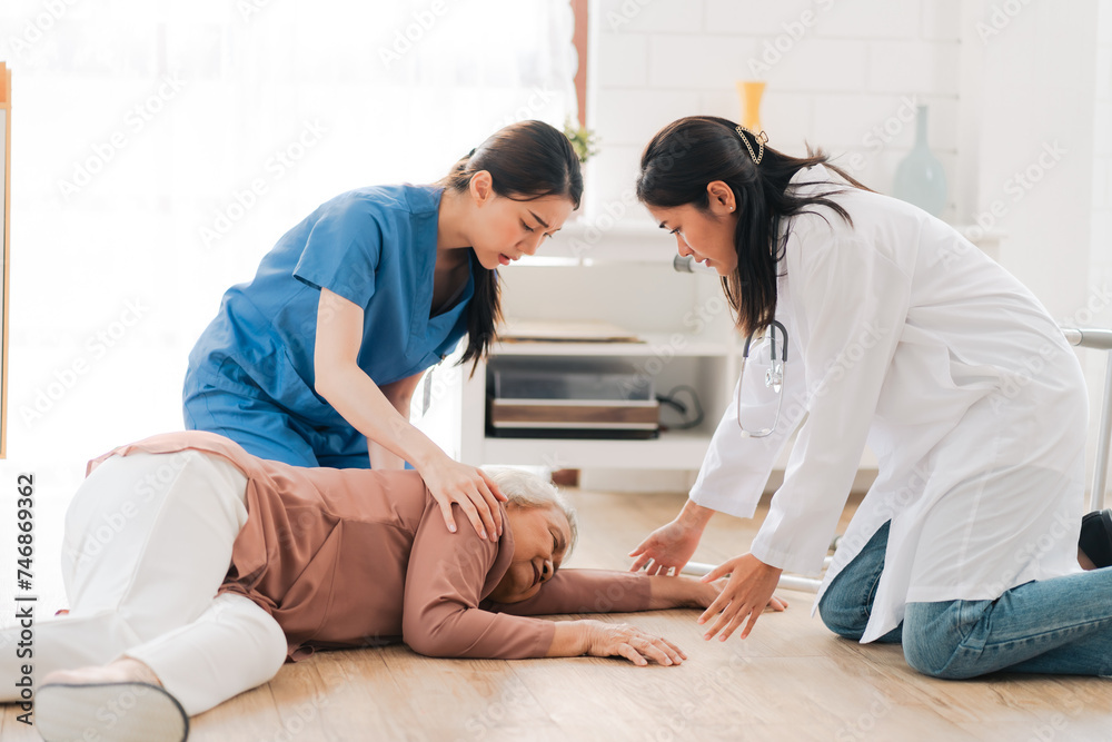 senior patient falling on the ground floor at home, Asian caregiver ...
