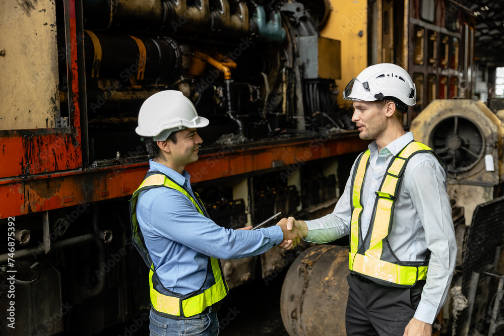 Team railway engineer Inspect repair project train diesel engine in ...