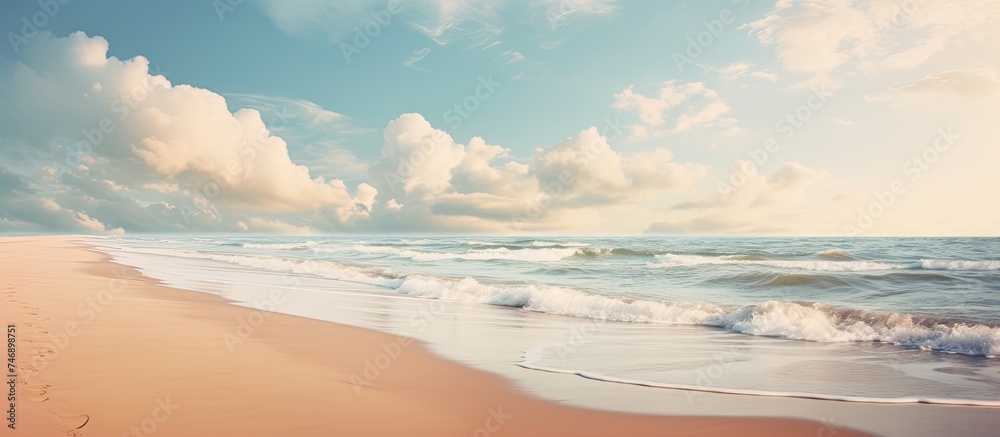 This painting depicts a beach scene with waves rolling in, creating a ...