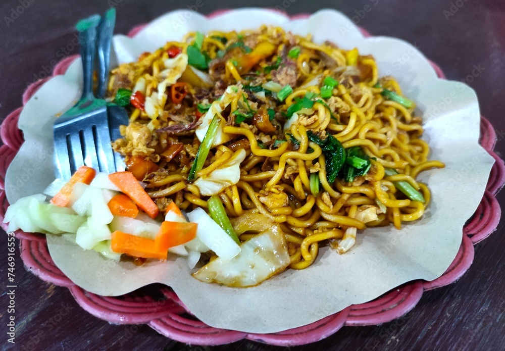 Mie Goreng Jawa or Bakmi Jawa or Javanese noodles which comes with ...