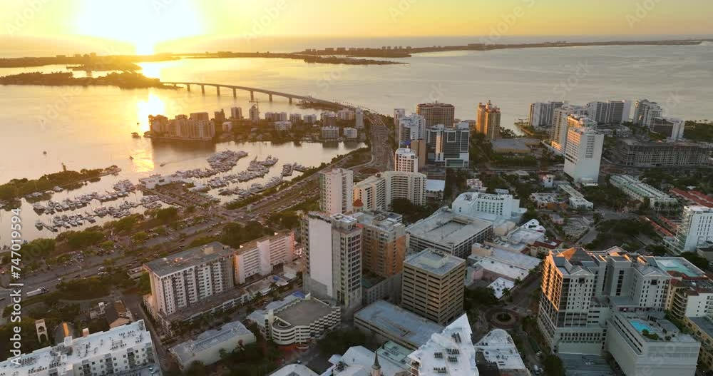 Vidéo Stock Aerial view of Sarasota city downtown at sunset with bay ...