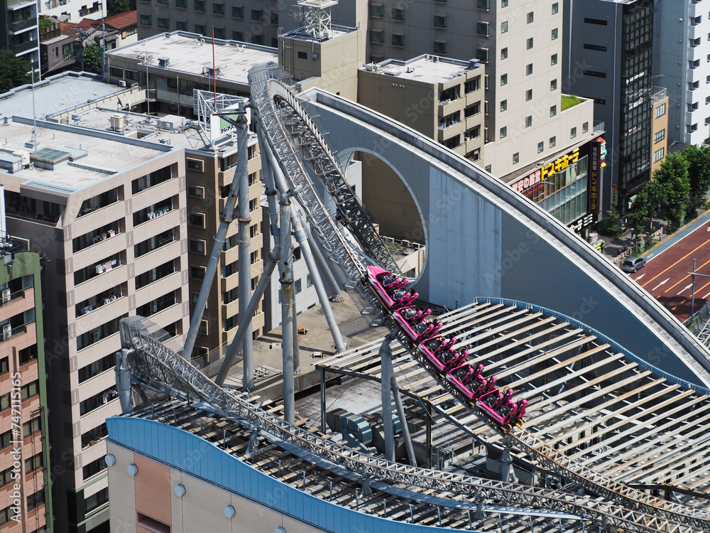 TOKYO, JAPAN - July 4, 2023: Overhead view of a roller coaster car on ...